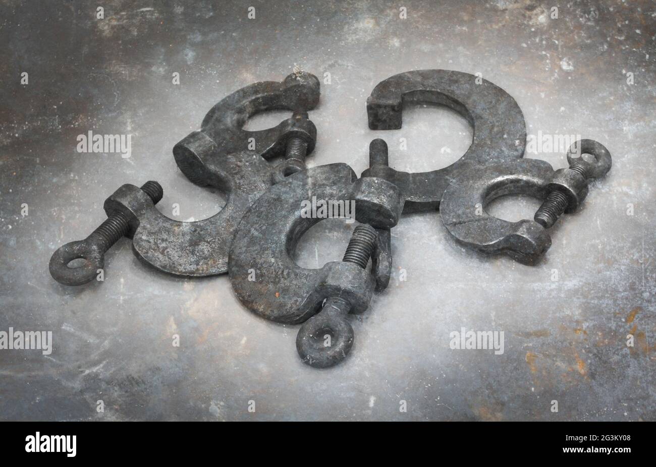 Collection of rusty metal clamps Stock Photo - Alamy