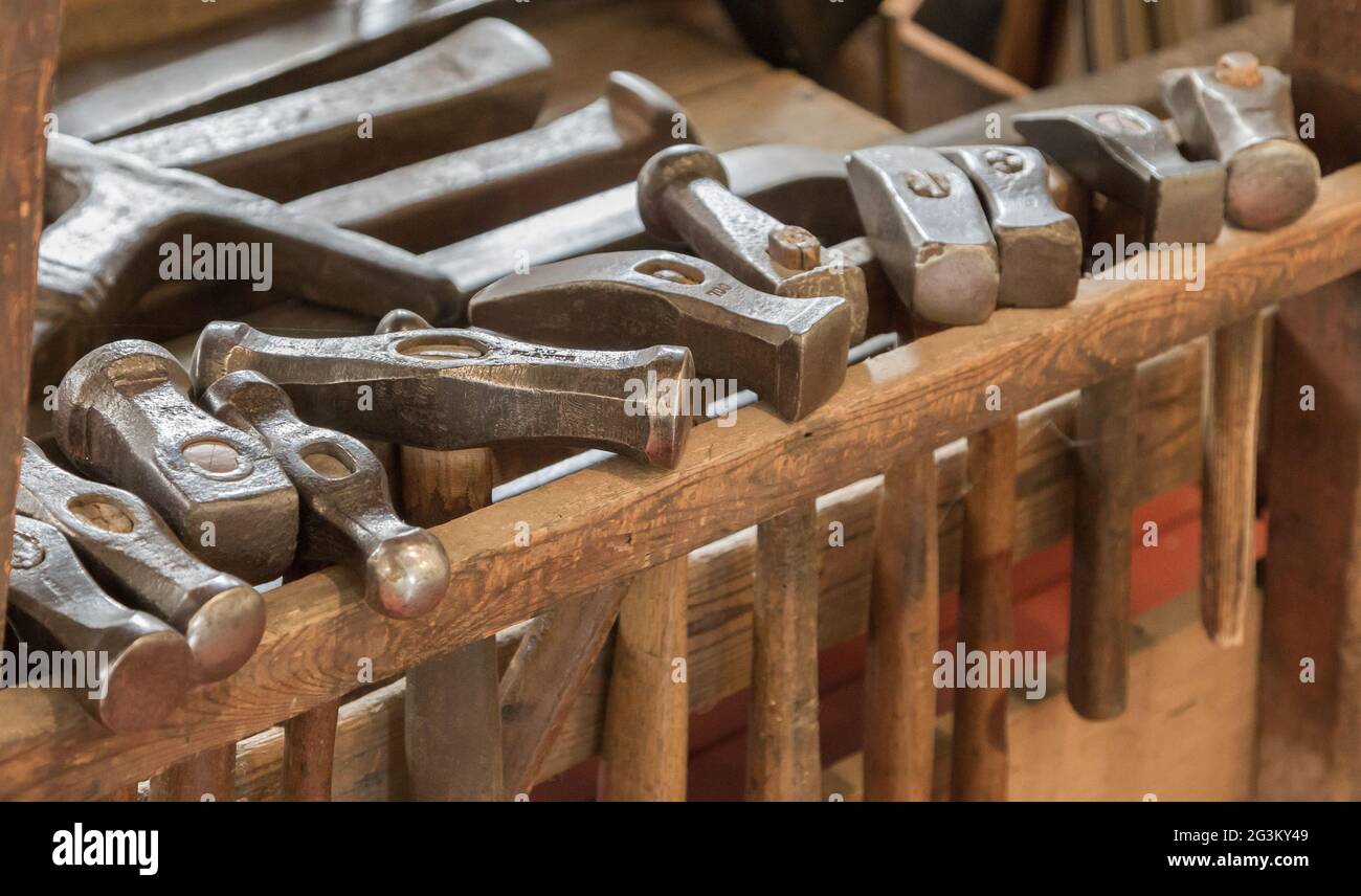 Collection of vintage woodworking tools on a rough workbench Stock ...