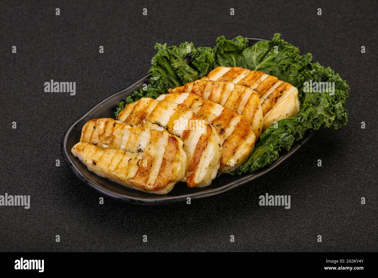 Grilled Greek haloumi cheese with herbs and spices Stock Photo - Alamy
