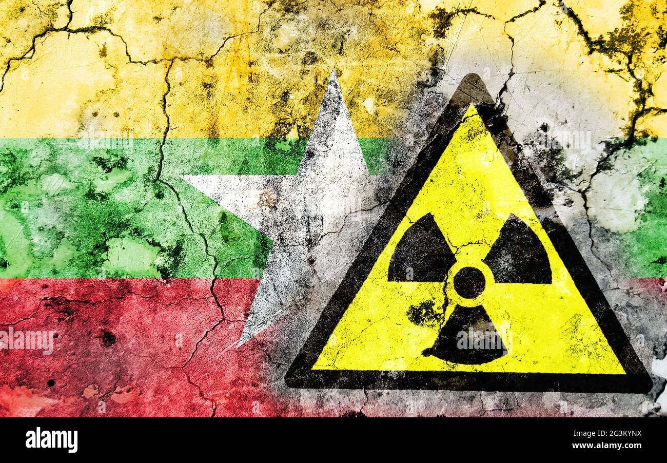 Old cracked wall with radiation warning sign and painted flag Stock ...