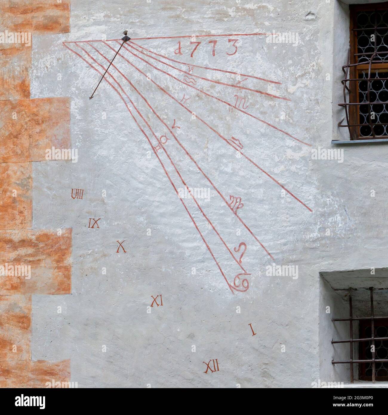 Sun watch on the house wall Stock Photo - Alamy