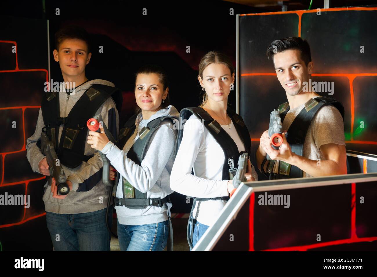 Young people with laser guns Stock Photo - Alamy