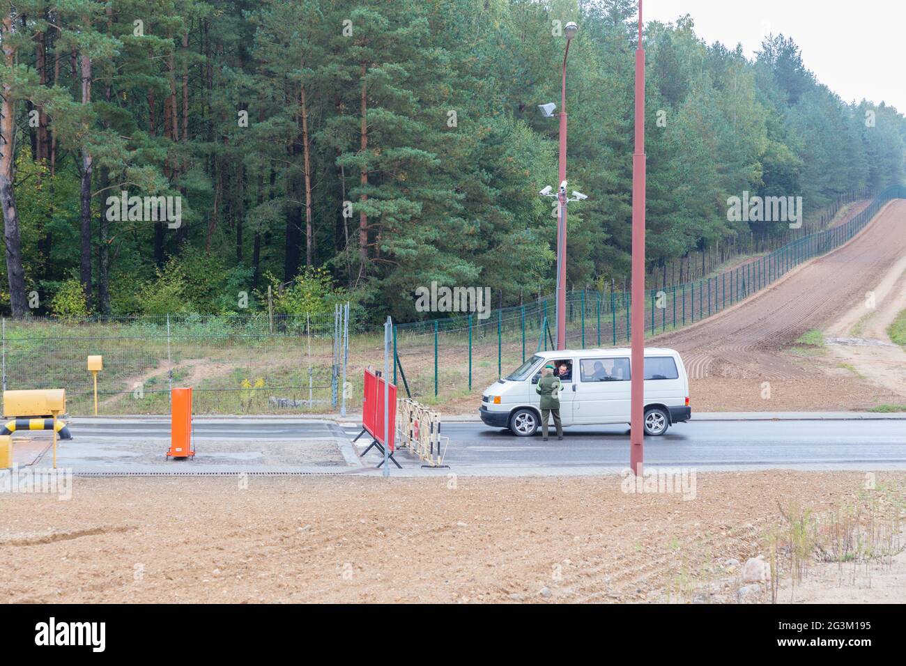 A female border guard checks the documents Stock Photo - Alamy