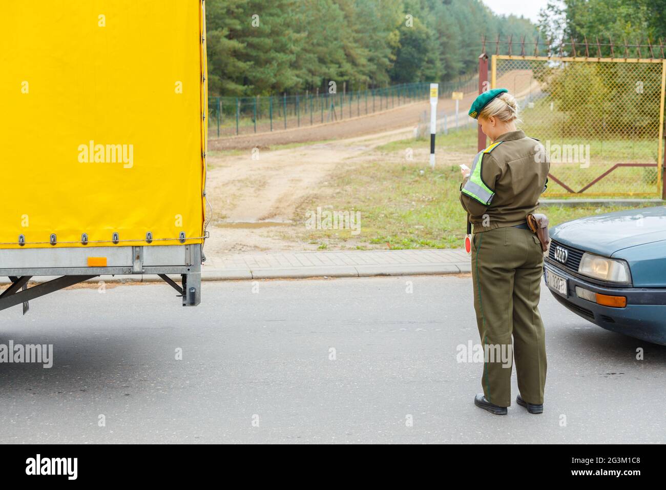 A female border guard checks the documents Stock Photo - Alamy