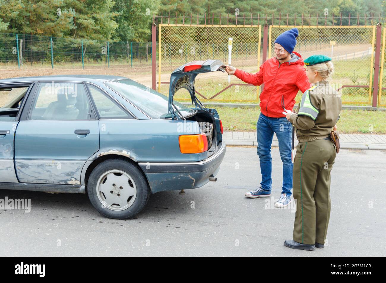 A female border guard checks the documents Stock Photo - Alamy