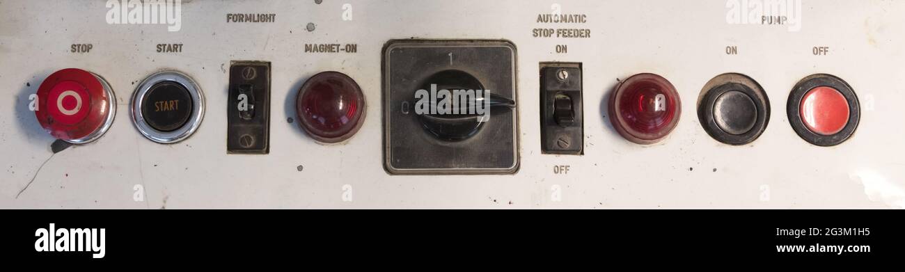 Small switches on a panel Stock Photo - Alamy