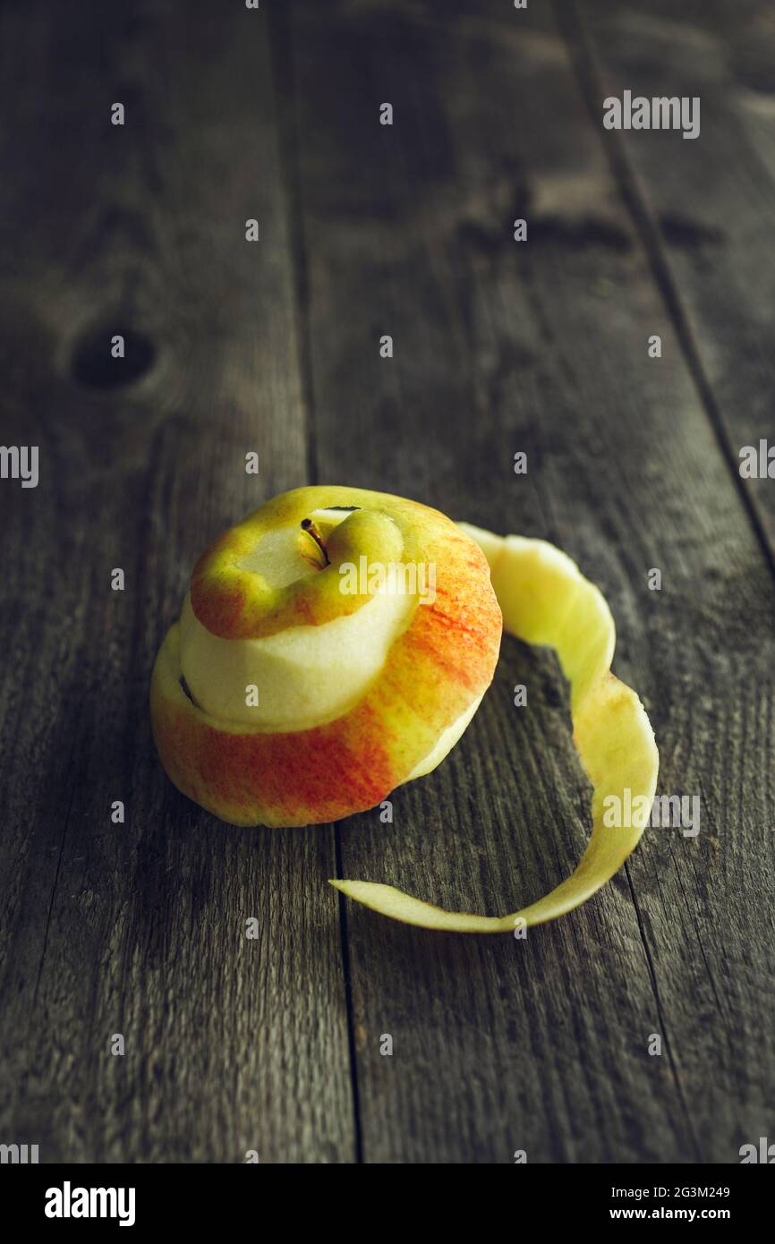 Apple with peeled skin Stock Photo - Alamy