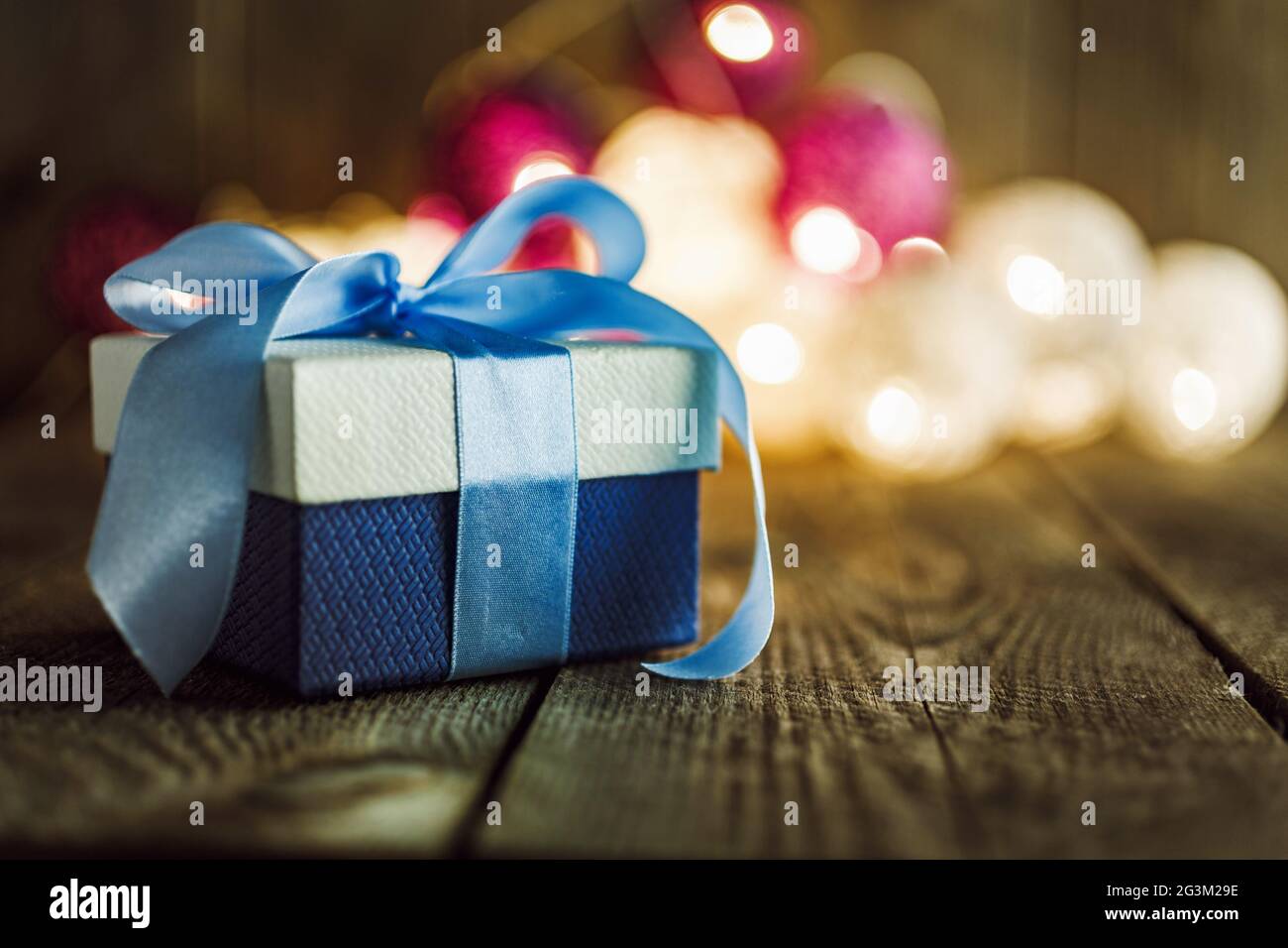 Christmas background with decorations and gift box on wooden board ...