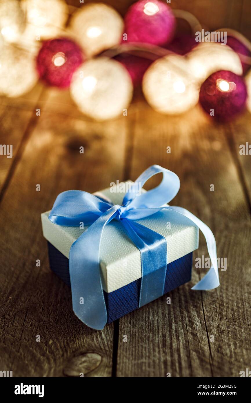 Christmas background with decorations and gift box on wooden board ...