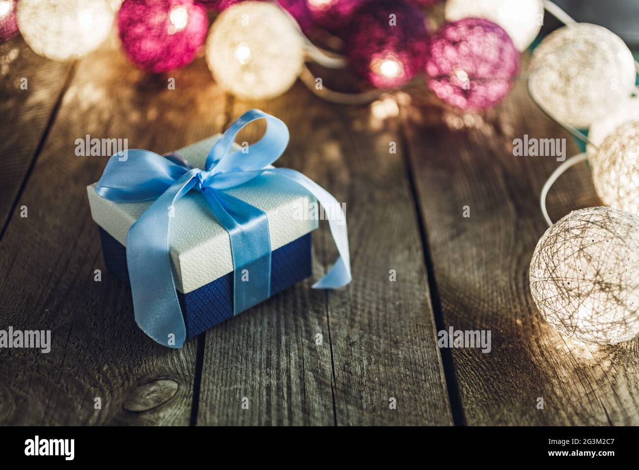 Christmas background with decorations and gift box on wooden board ...