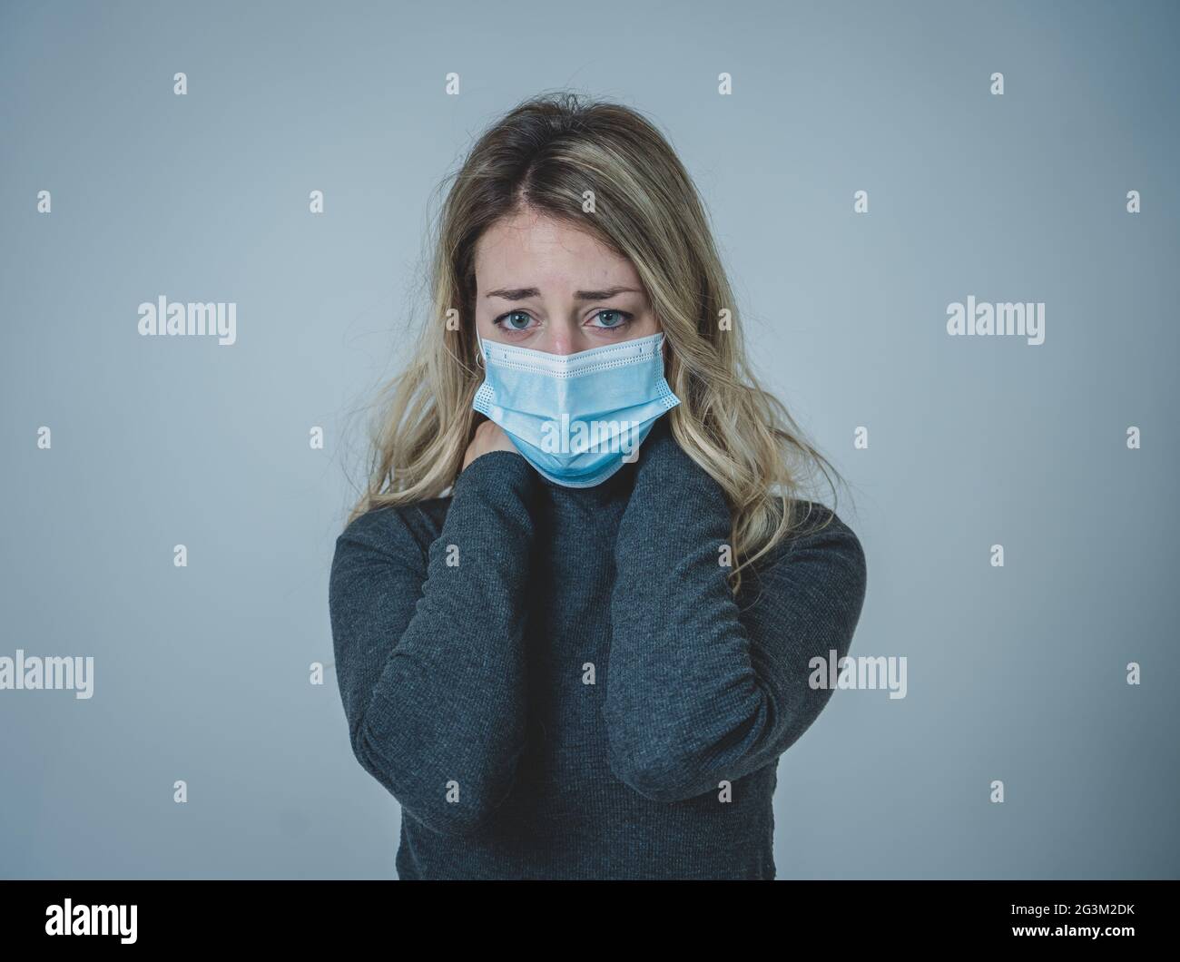 Sad depressed and worried woman with medical face mask feeling upset ...