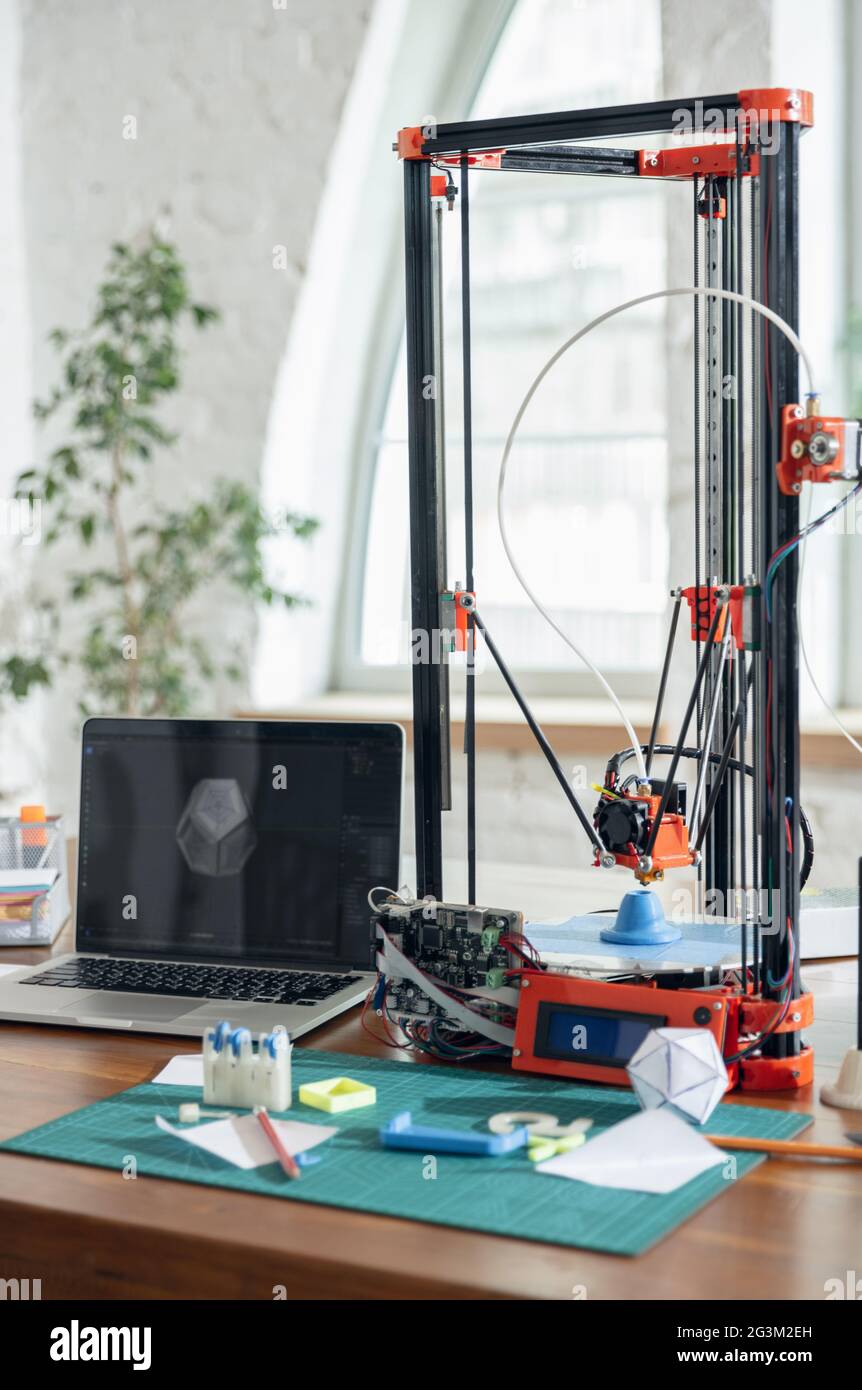New generation of 3D Printing Machine printing a piece of plastic. For ...