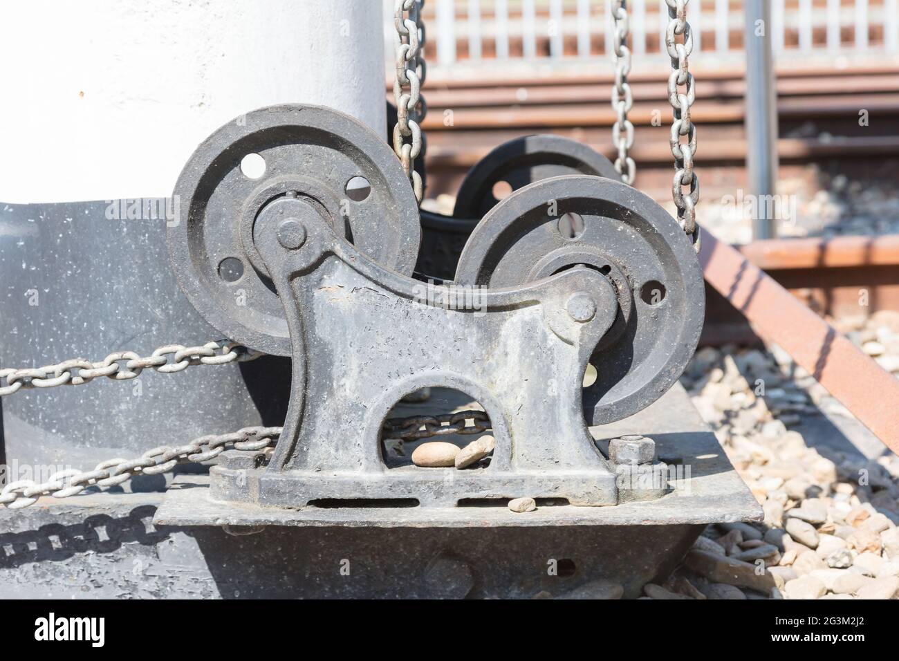 Heavy metal chains used on a vintage railway station Stock Photo - Alamy