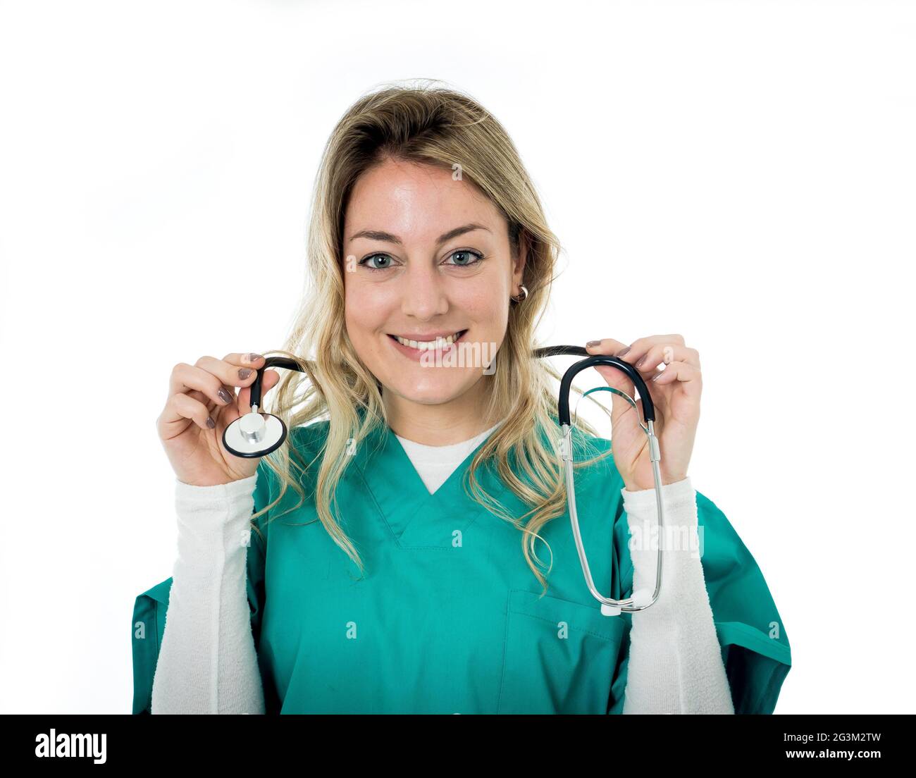 Portrait of surgeon in scrubs holding stethoscope hi-res stock ...