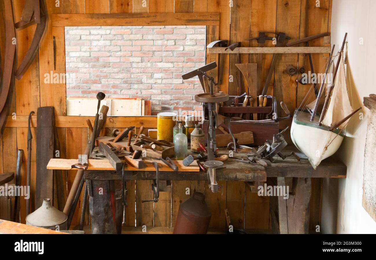 Collection of vintage woodworking tools on a rough workbench Stock ...