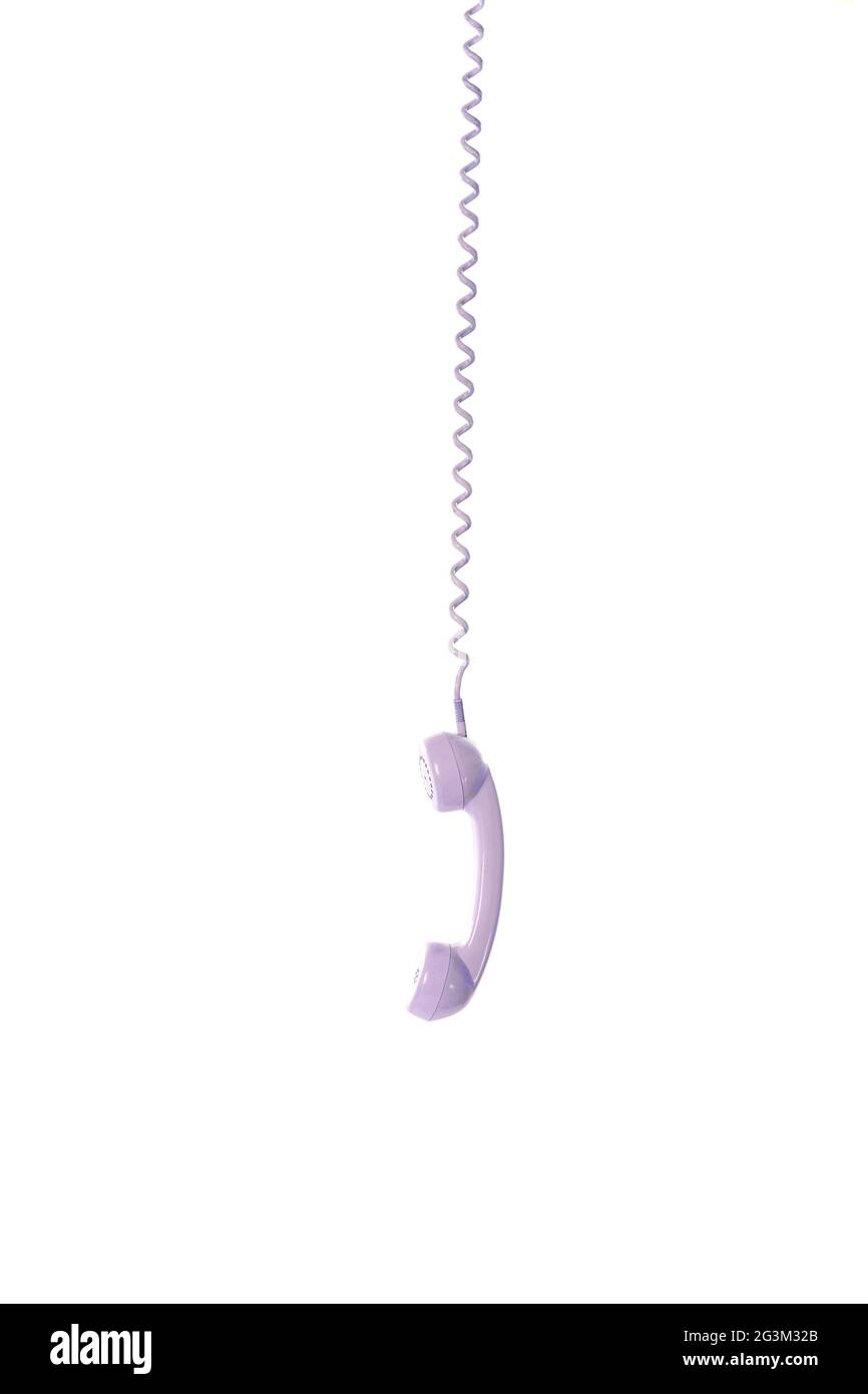 Vintage telephone hanging on a white background Stock Photo - Alamy