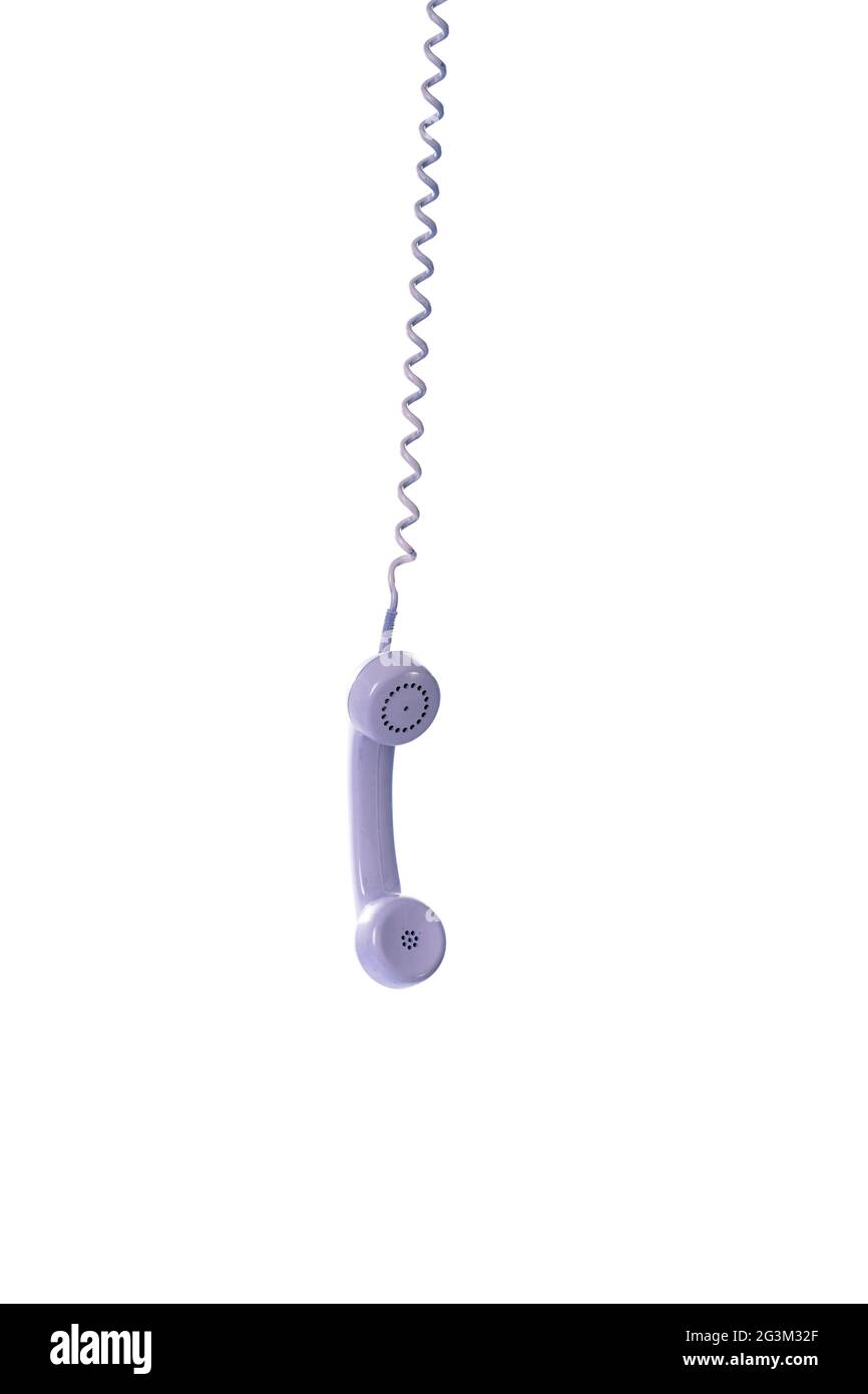 Vintage telephone hanging on a white background Stock Photo - Alamy