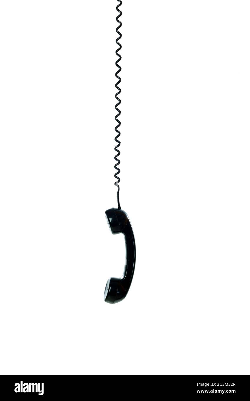 Vintage telephone hanging on a white background Stock Photo - Alamy