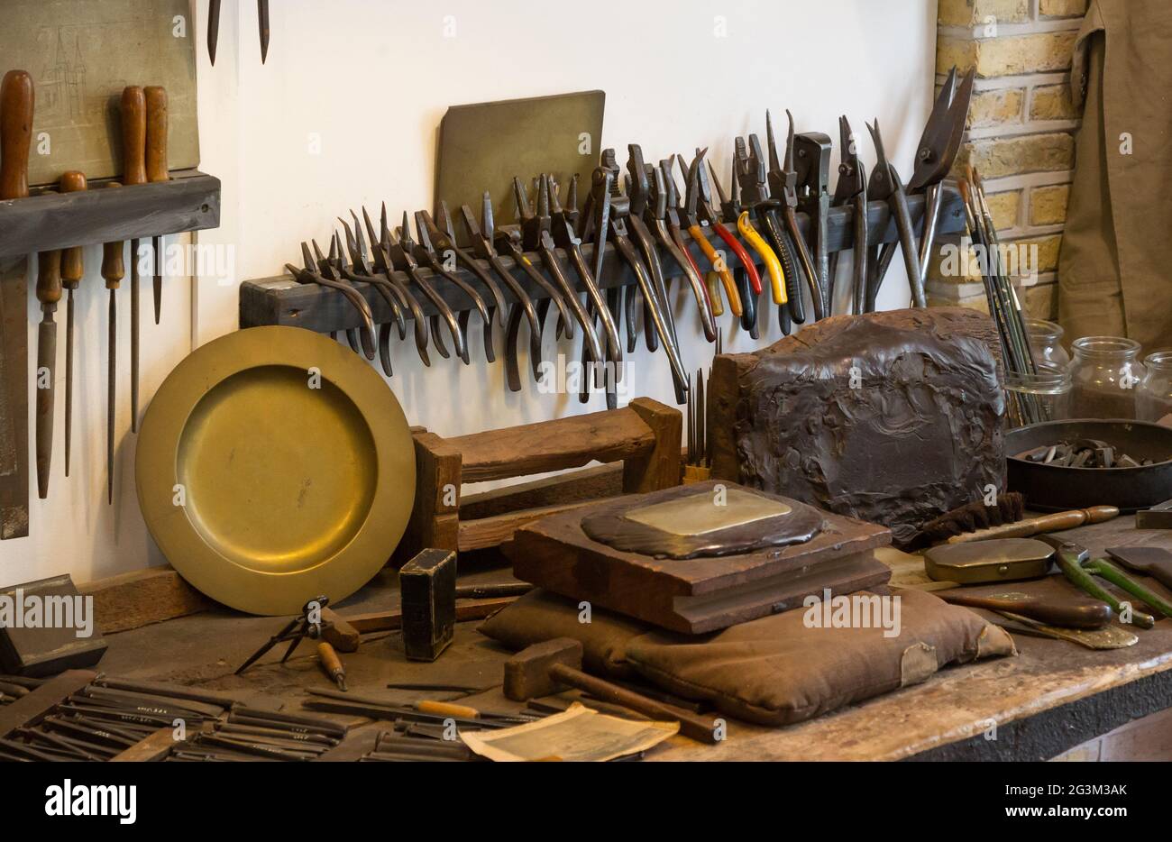 Collection of vintage woodworking tools on a rough workbench Stock ...