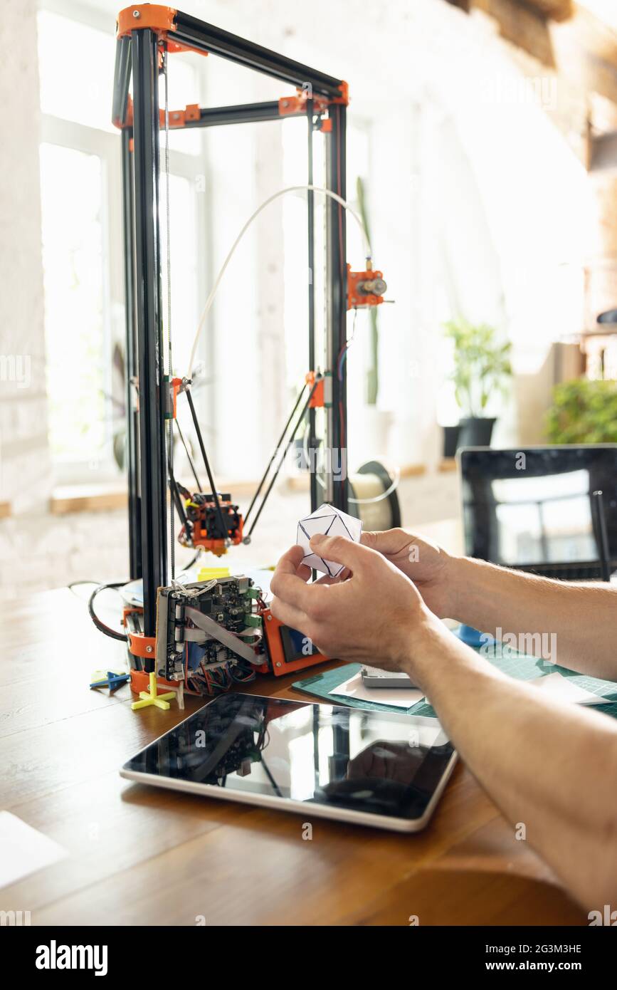 New generation of 3D Printing Machine printing a piece of plastic. For ...