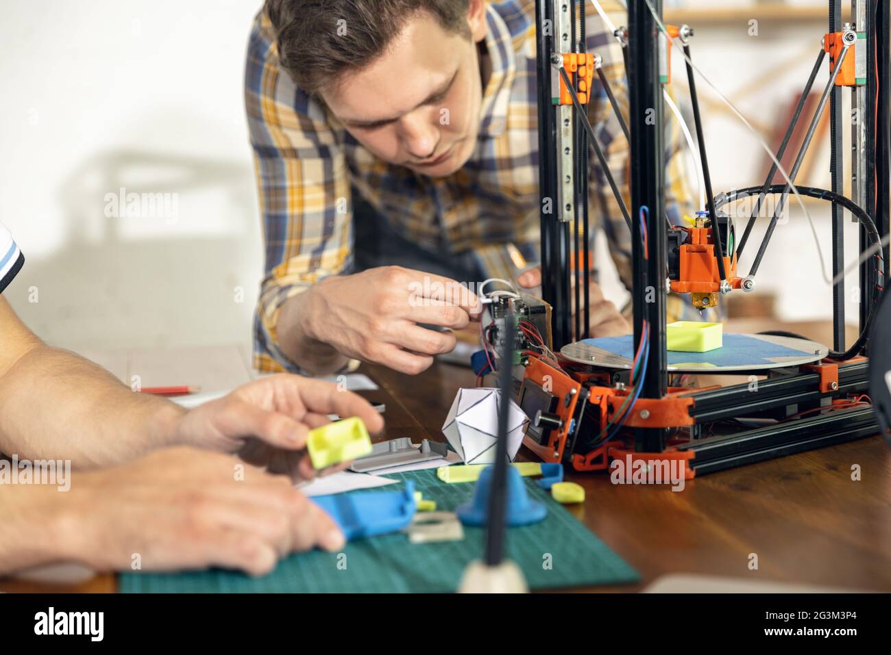 New generation of 3D Printing Machine printing a piece of plastic. For ...