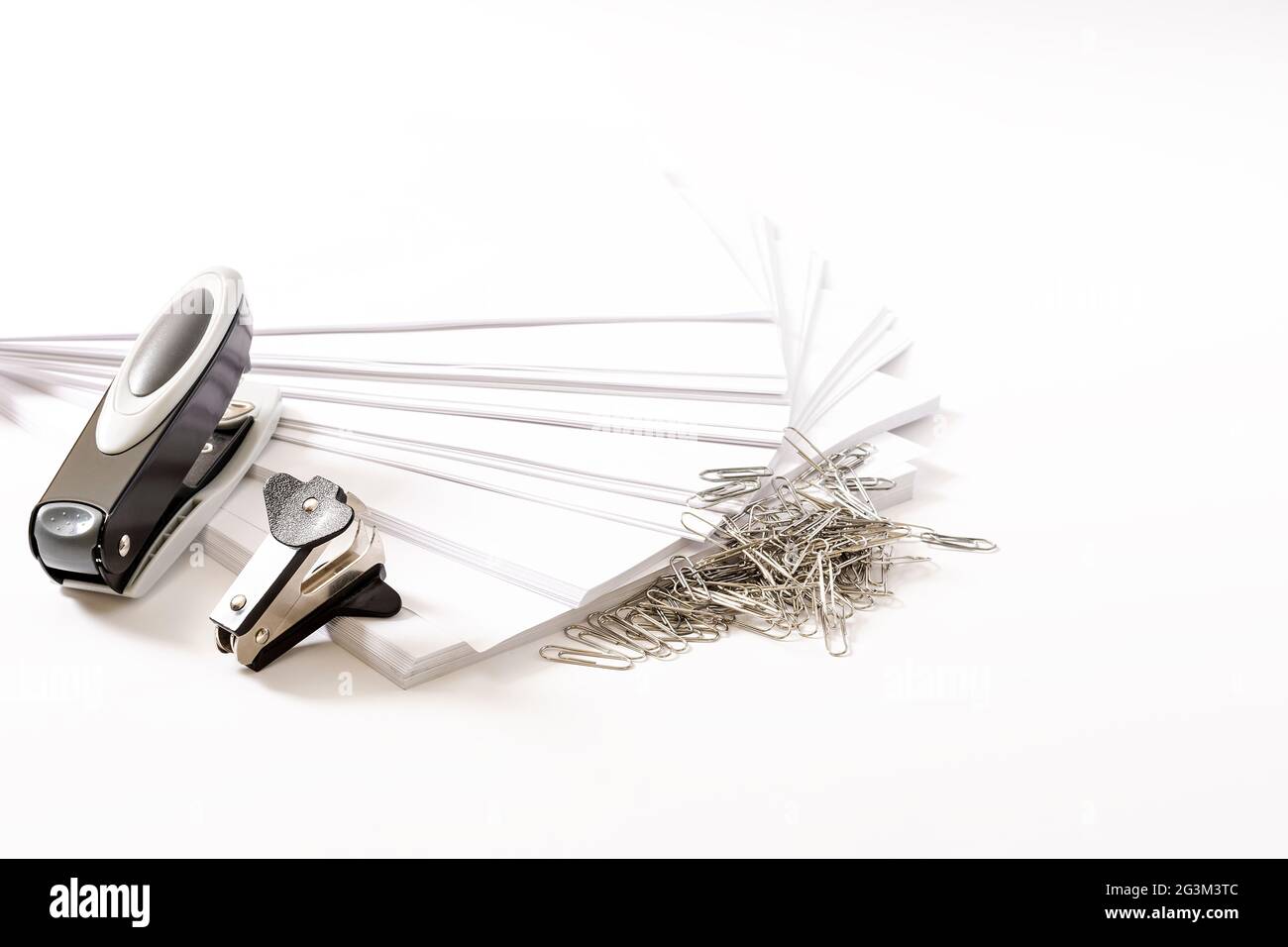 Photograph on a white background of some fan-shaped sheets of paper, a ...