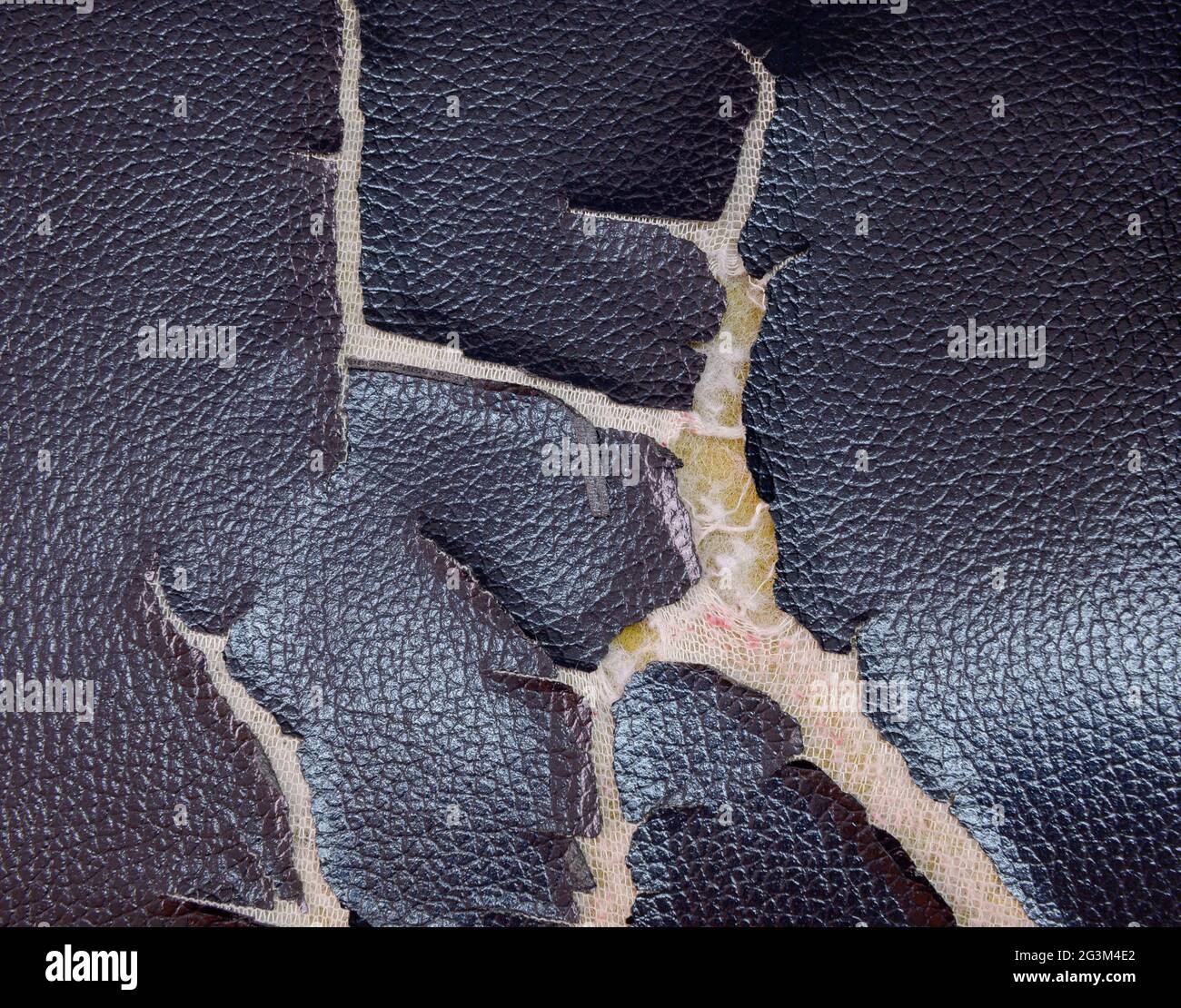 Surface of leatherette on the sofa is damaged Stock Photo - Alamy