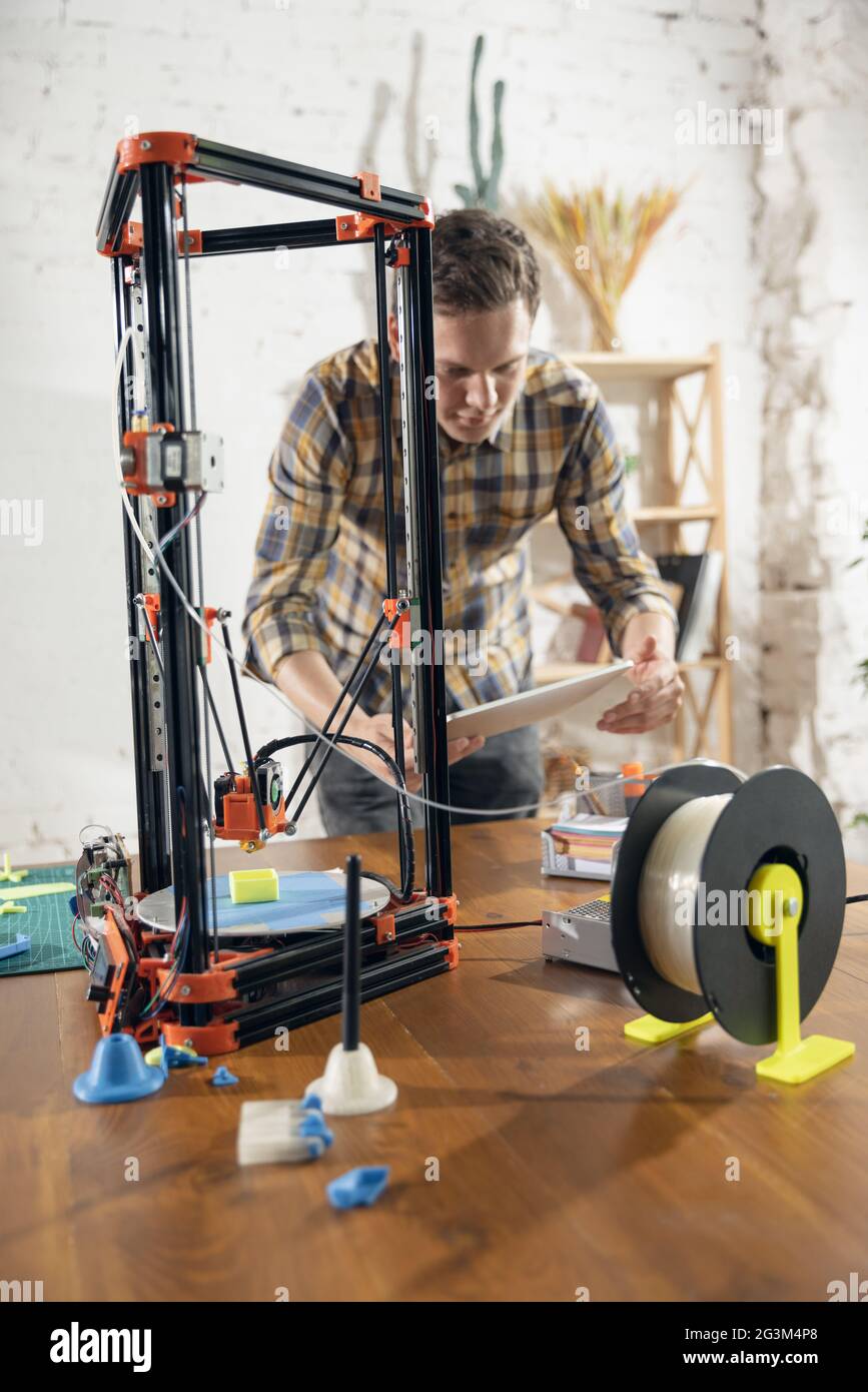 New generation of 3D Printing Machine printing a piece of plastic. For ...