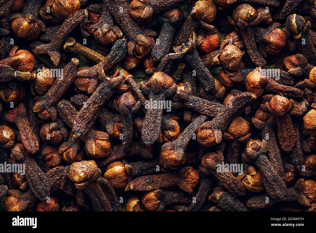 Raw organic brown dried cloves background Stock Photo - Alamy