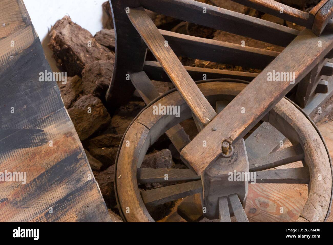 Old wheel on a wheelbarrow Stock Photo - Alamy