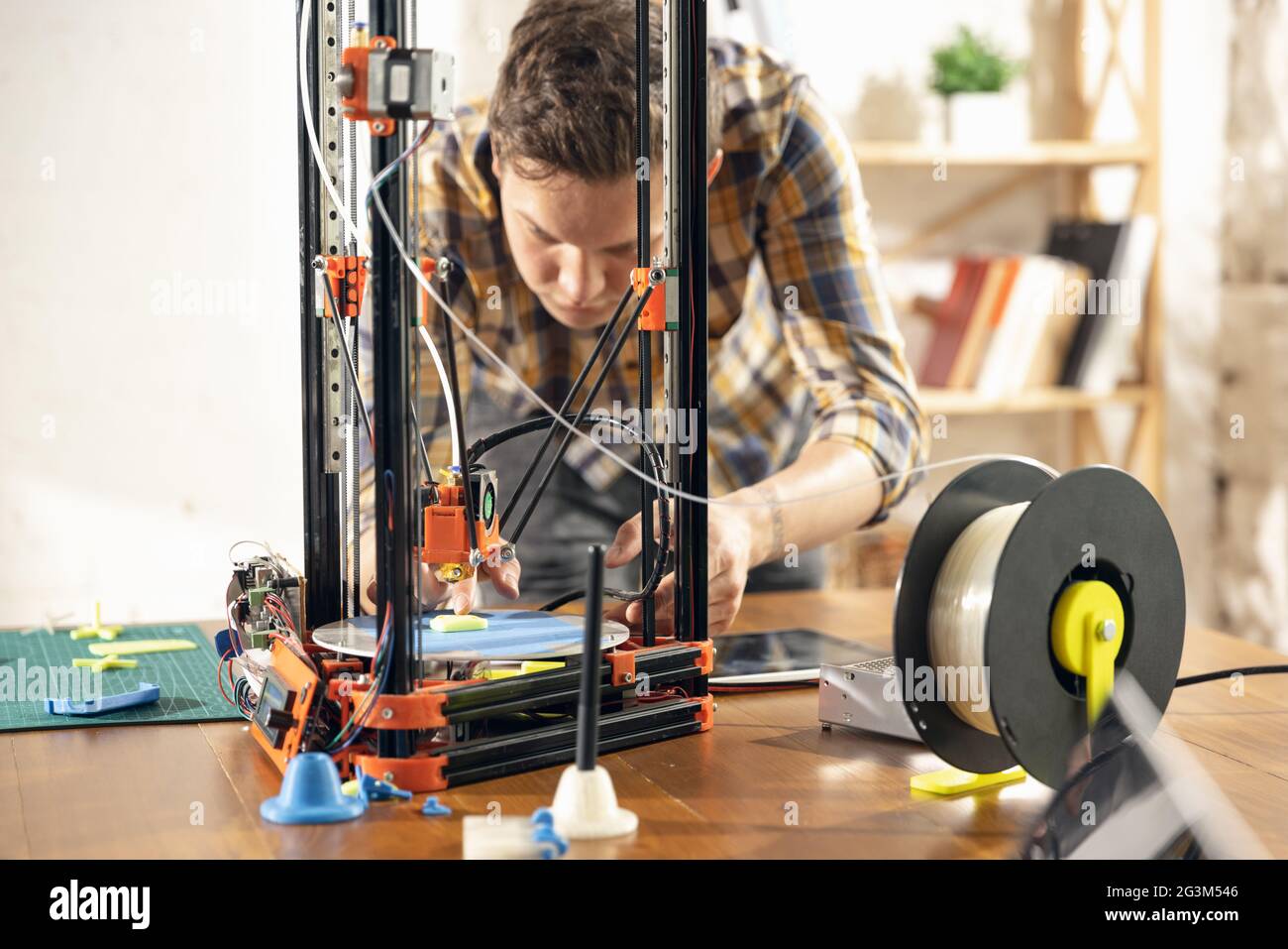 New generation of 3D Printing Machine printing a piece of plastic. For ...