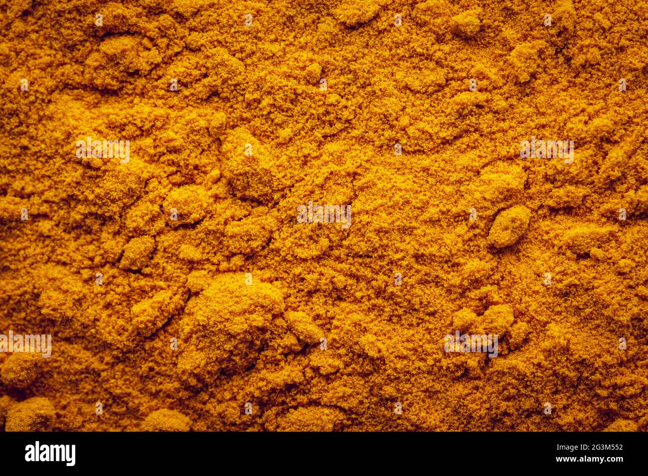 Turmeric powder macro Background Stock Photo - Alamy