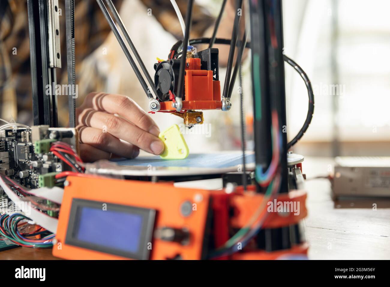 New generation of 3D Printing Machine printing a piece of plastic. For ...