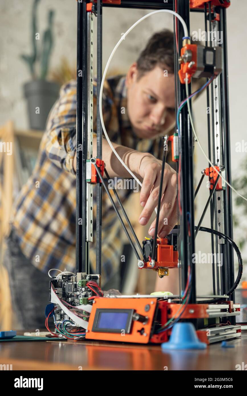 New generation of 3D Printing Machine printing a piece of plastic. For ...