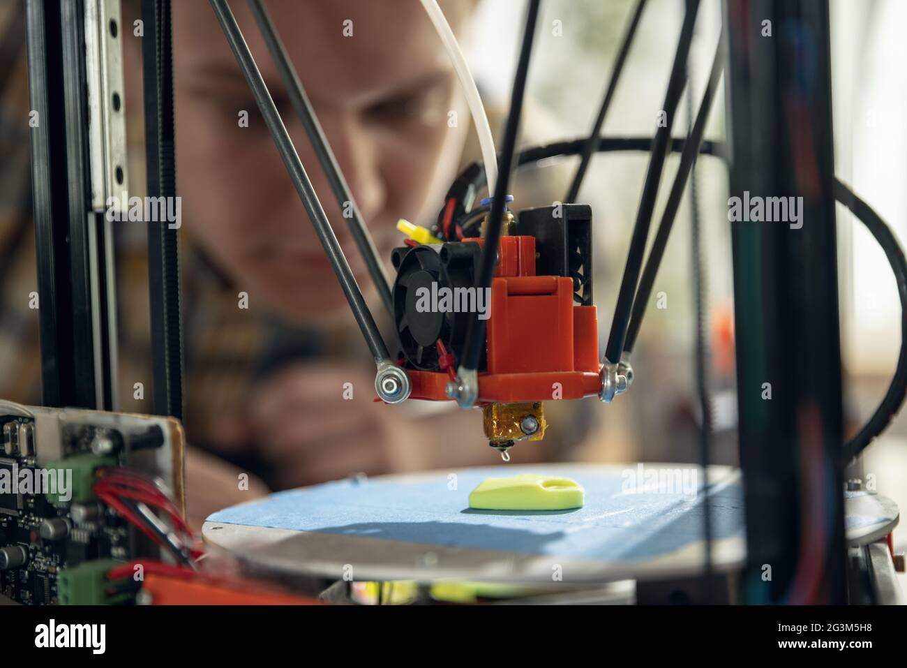 New generation of 3D Printing Machine printing a piece of plastic. For ...