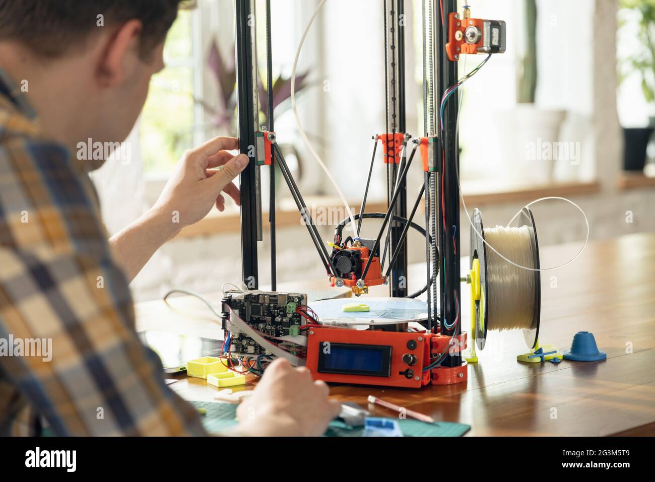 New generation of 3D Printing Machine printing a piece of plastic. For ...