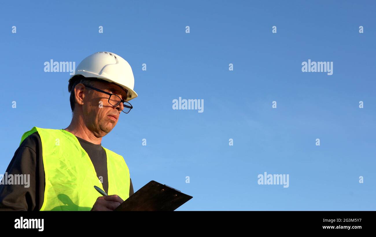 Senior engineer wearing safety helmet hi-res stock photography and ...