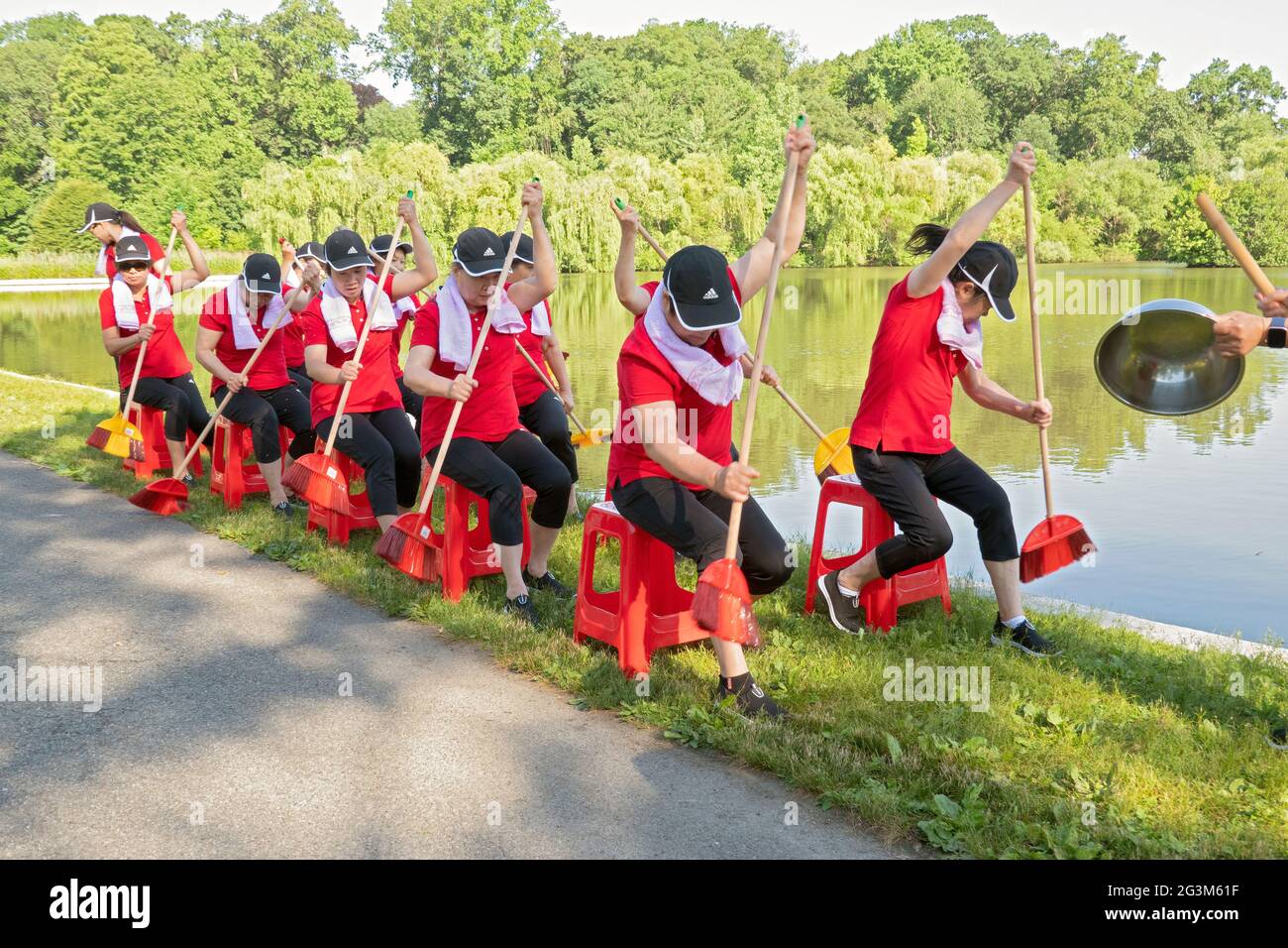 Middle age Chinese American dancer performing artists rehearse a rowing ...