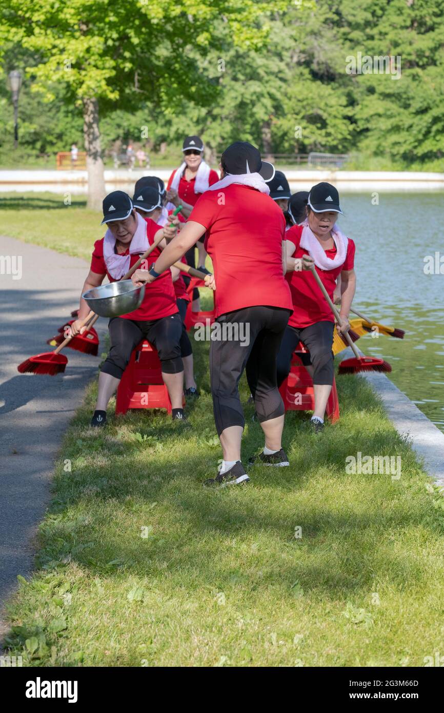 Middle age Chinese American dancer performing artists rehearse a rowing ...