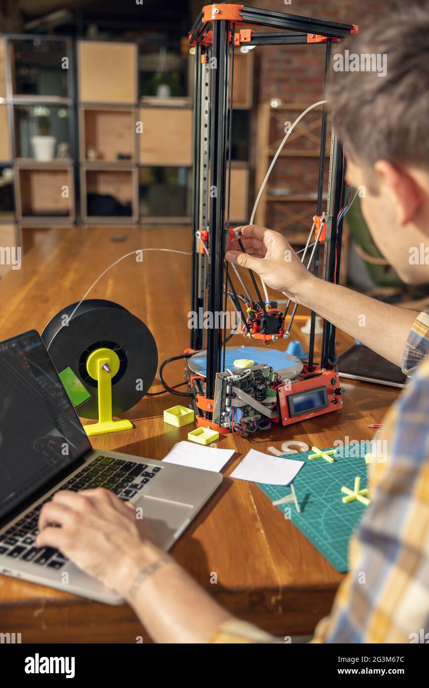 New generation of 3D Printing Machine printing a piece of plastic. For ...