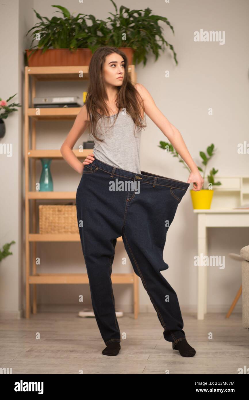 New clothes trying on Stock Photo - Alamy