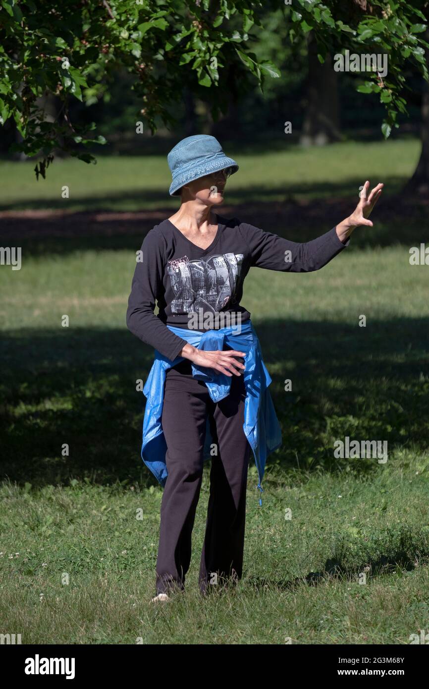Asian American Buddhists circumambulate a tree as a sign of veneration ...