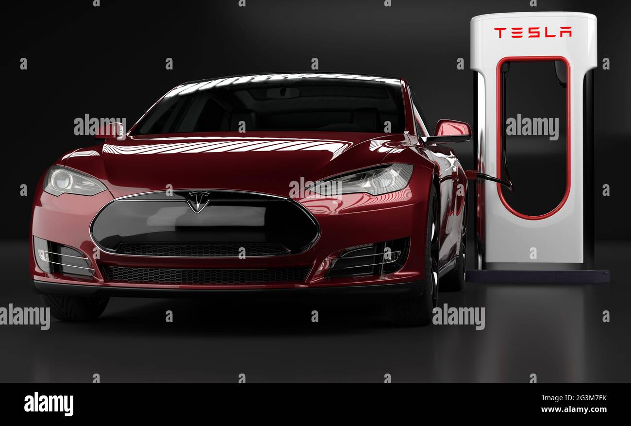 Tesla Model S Electric Limousine and Tesla Supercharger on a black ...