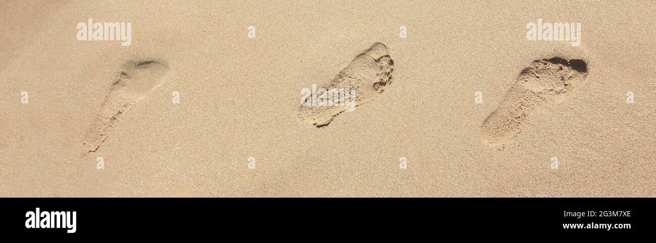 Sand with footprints and on the sea side. Background banner Stock Photo ...