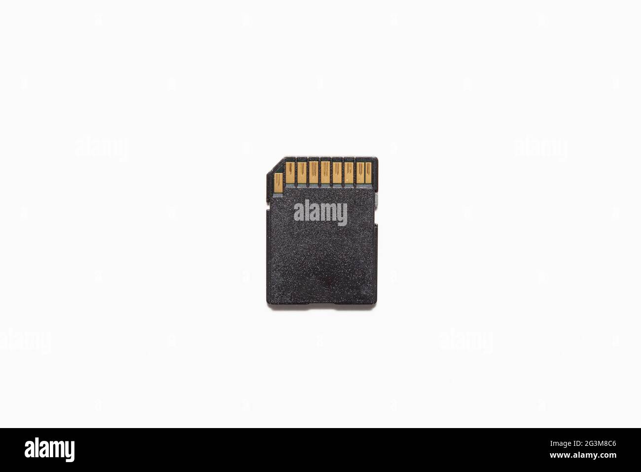 Black SD memory card placed on a white background. The connectors are ...