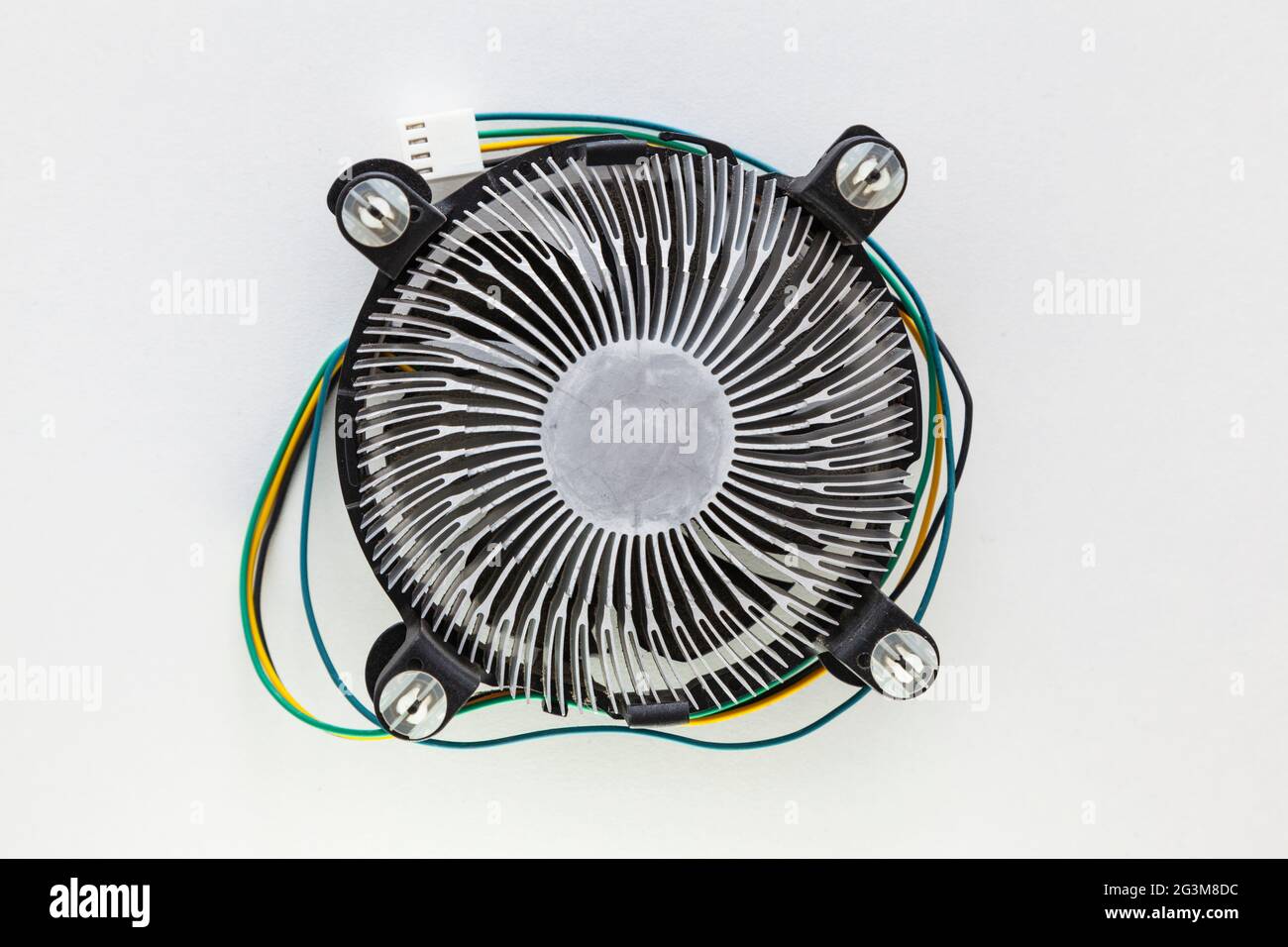 Heatsink fan of a microprocessor on a white background. It has yellow ...