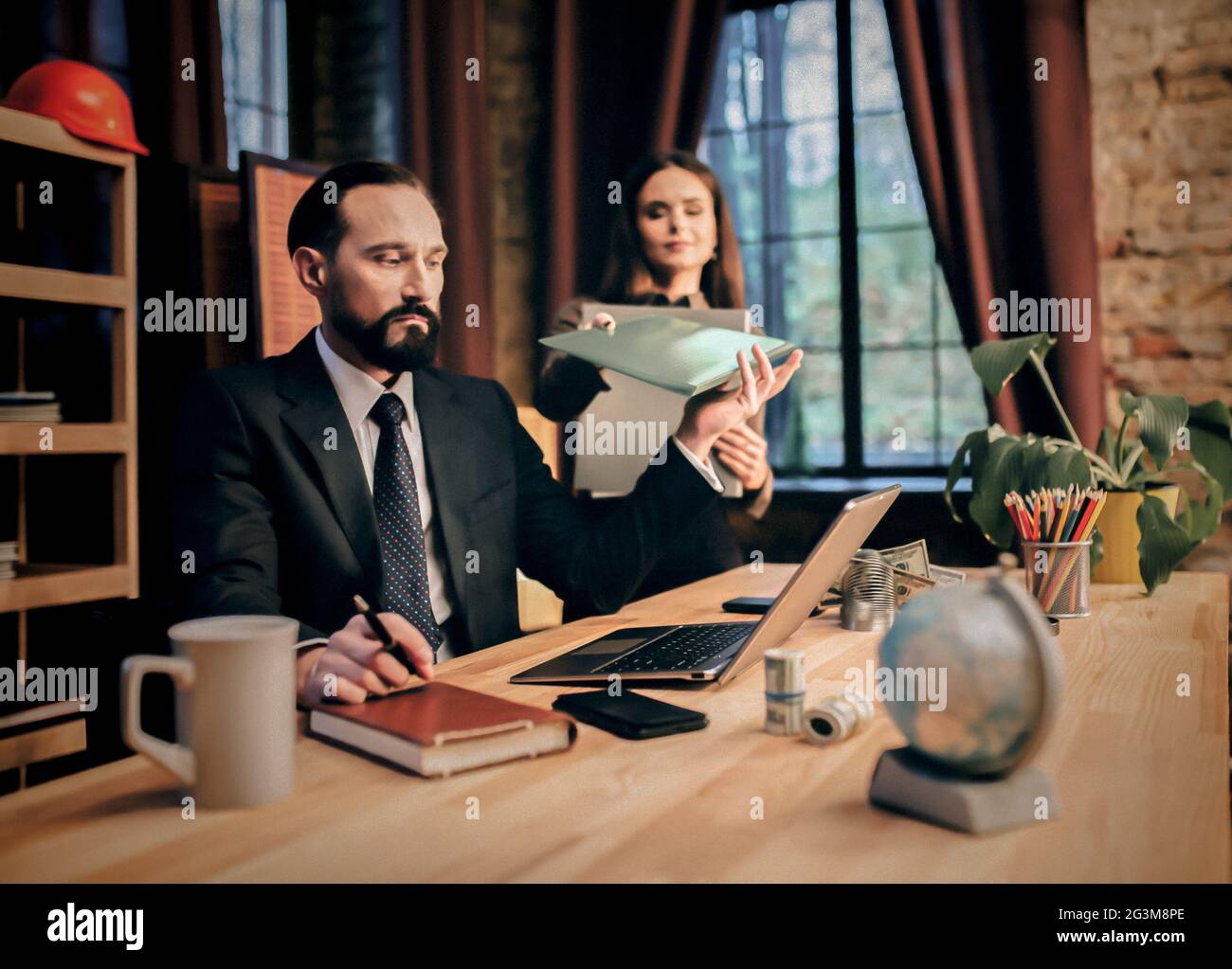 Female boss to discuss hi-res stock photography and images - Alamy