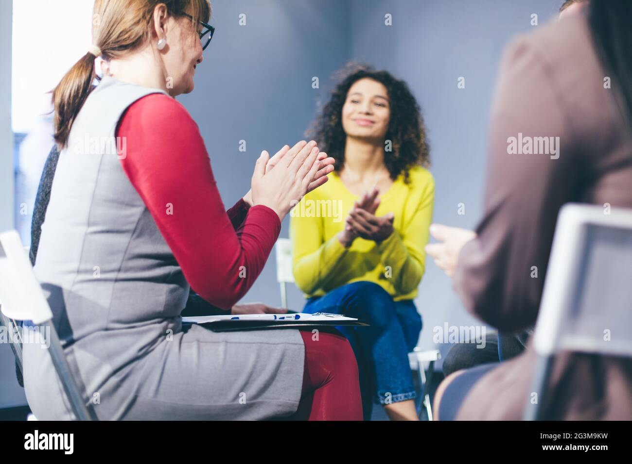Group therapy session sitting in a circle Stock Photo - Alamy