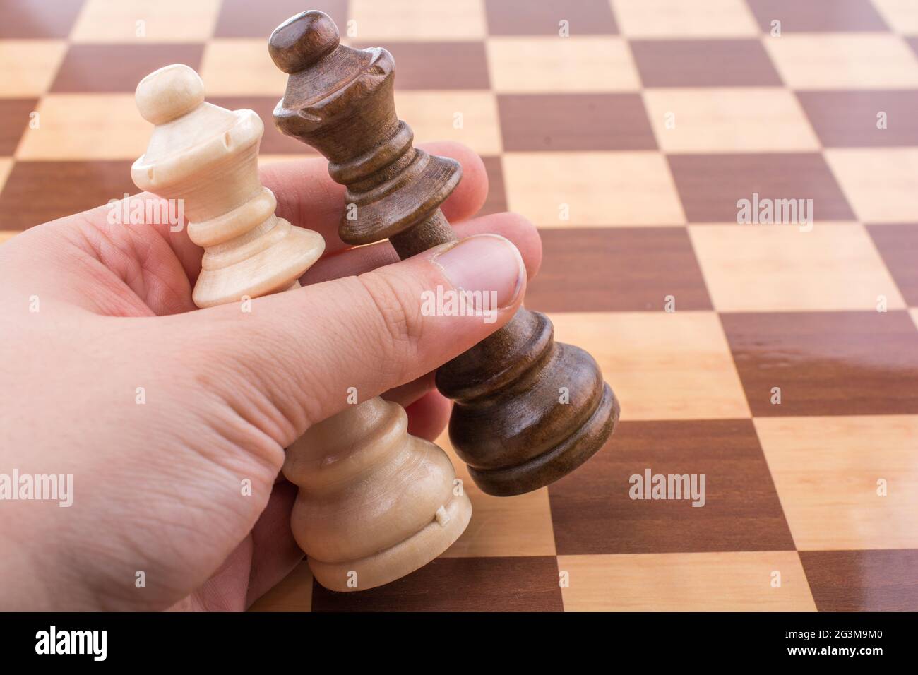 Person playing chess game making a move Stock Photo - Alamy