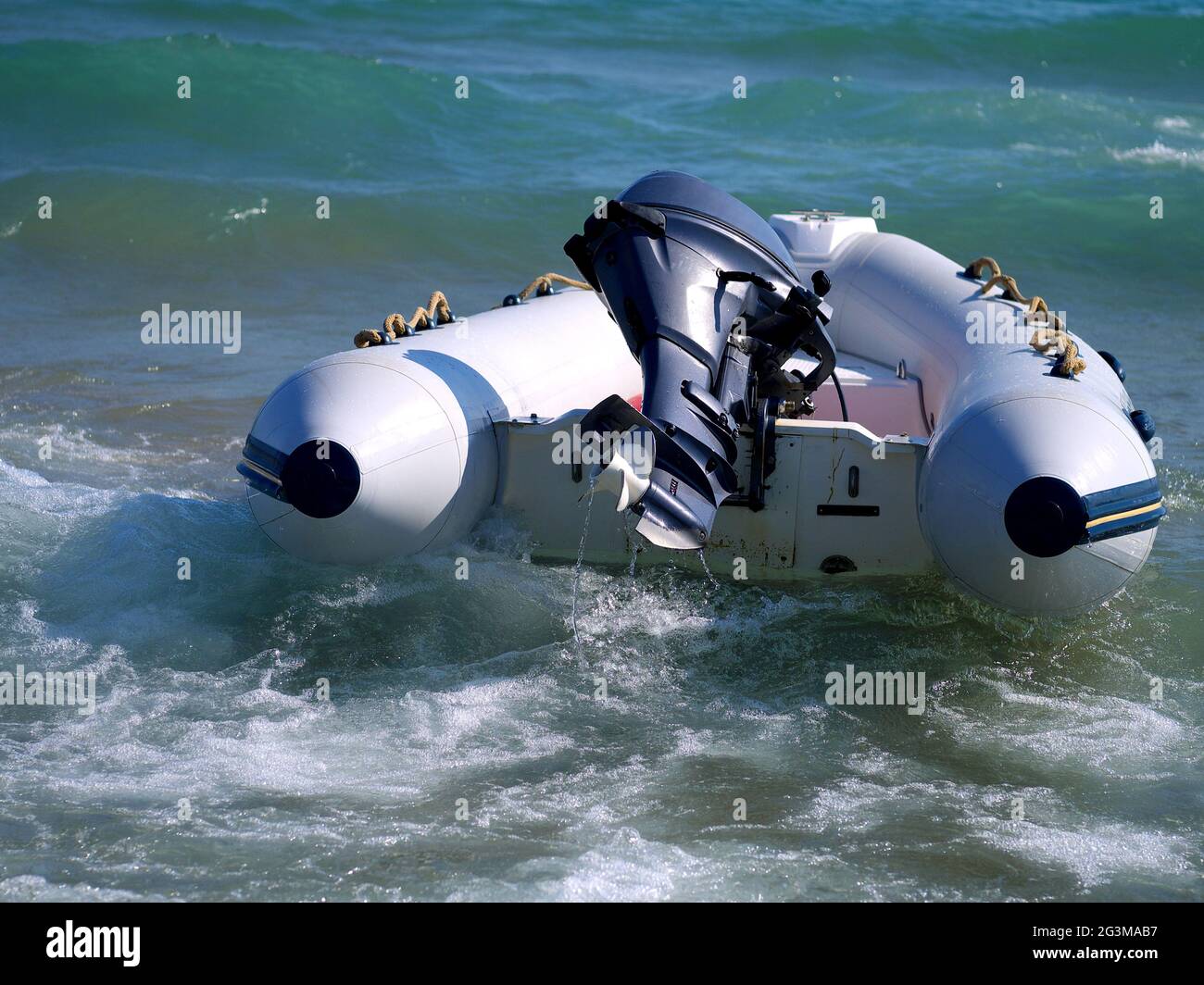 inflatable boat with motor on a water Stock Photo - Alamy
